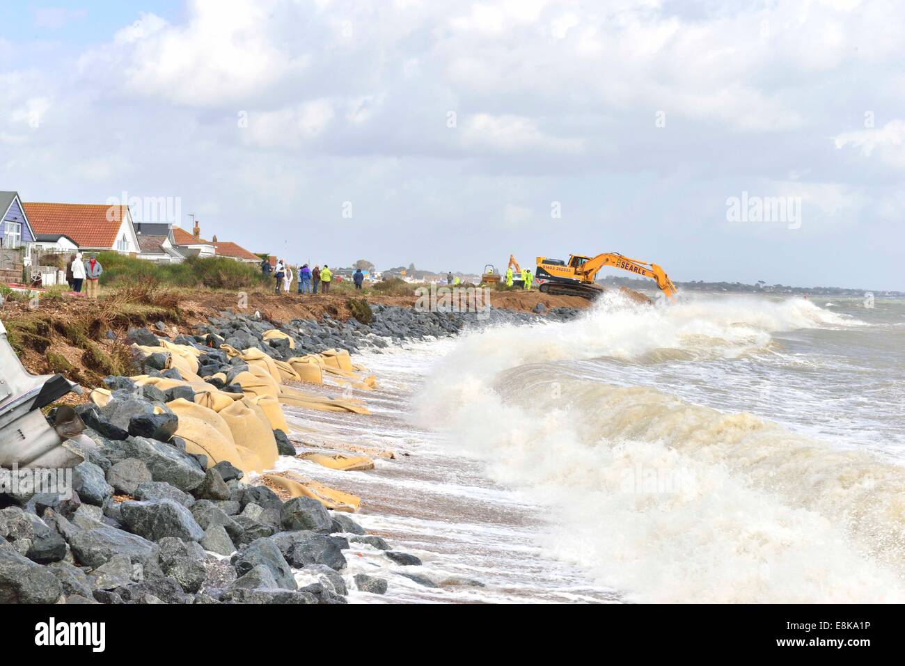 Storms pound the seas on shingle beach up to the houses along Pagham ...
