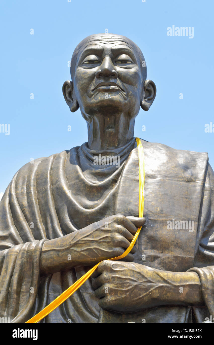 Large black statue of Luang Pho To monks in the public areas of the Tan ...