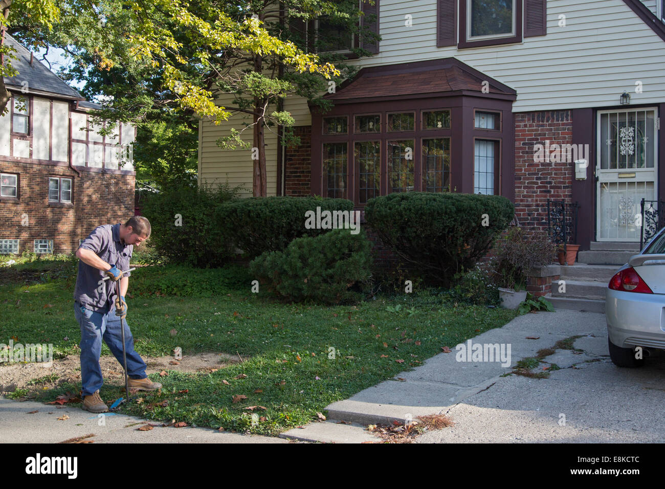 Detroit, Michigan - A worker for the city's contractor, Homrich, shuts ...