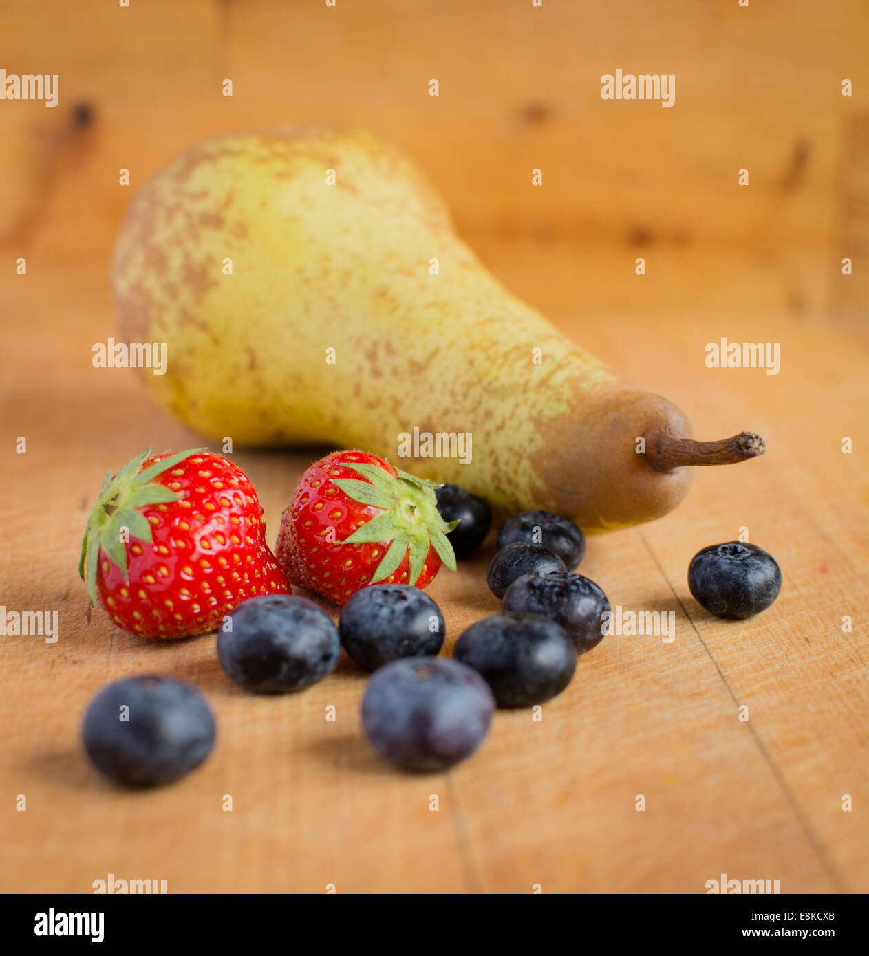 Blueberries, strawberry and pear Stock Photo - Alamy