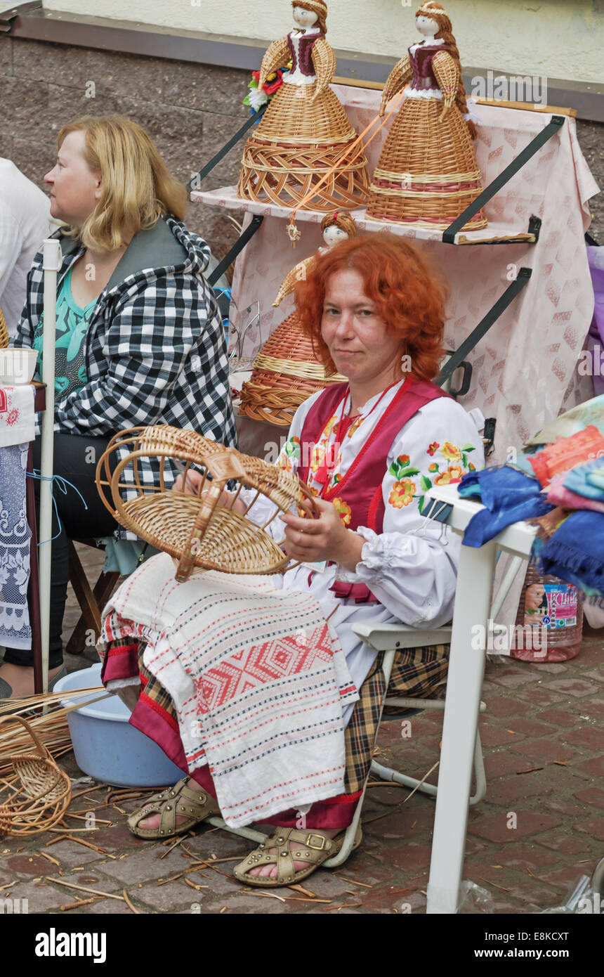 Street of the festival city. The folk master-woman and their works ...