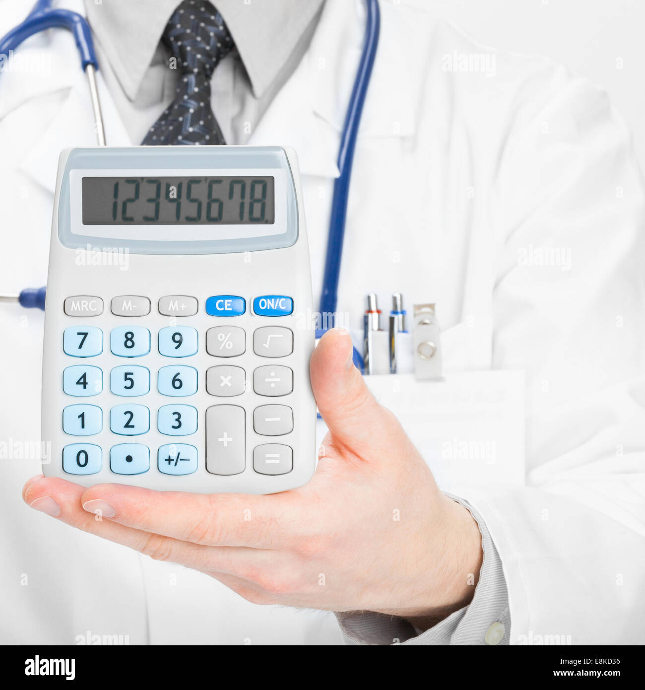 Doctor with calculator - heath care concept - 1 to 1 ratio Stock Photo ...