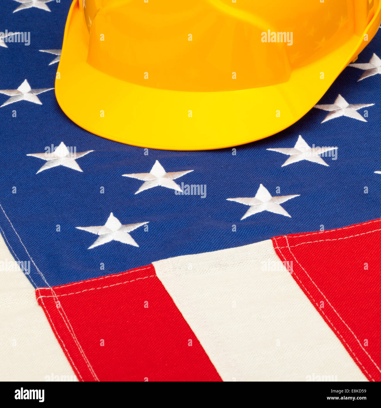 Yellow protective helmet over US flag - closeup shoot - 1 to 1 ratio ...