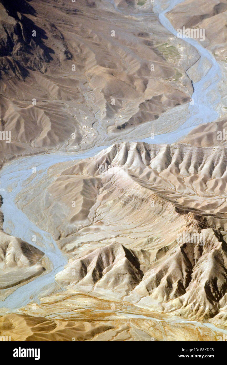 Aerial of long distant mountainous & barren desert-like barren ...