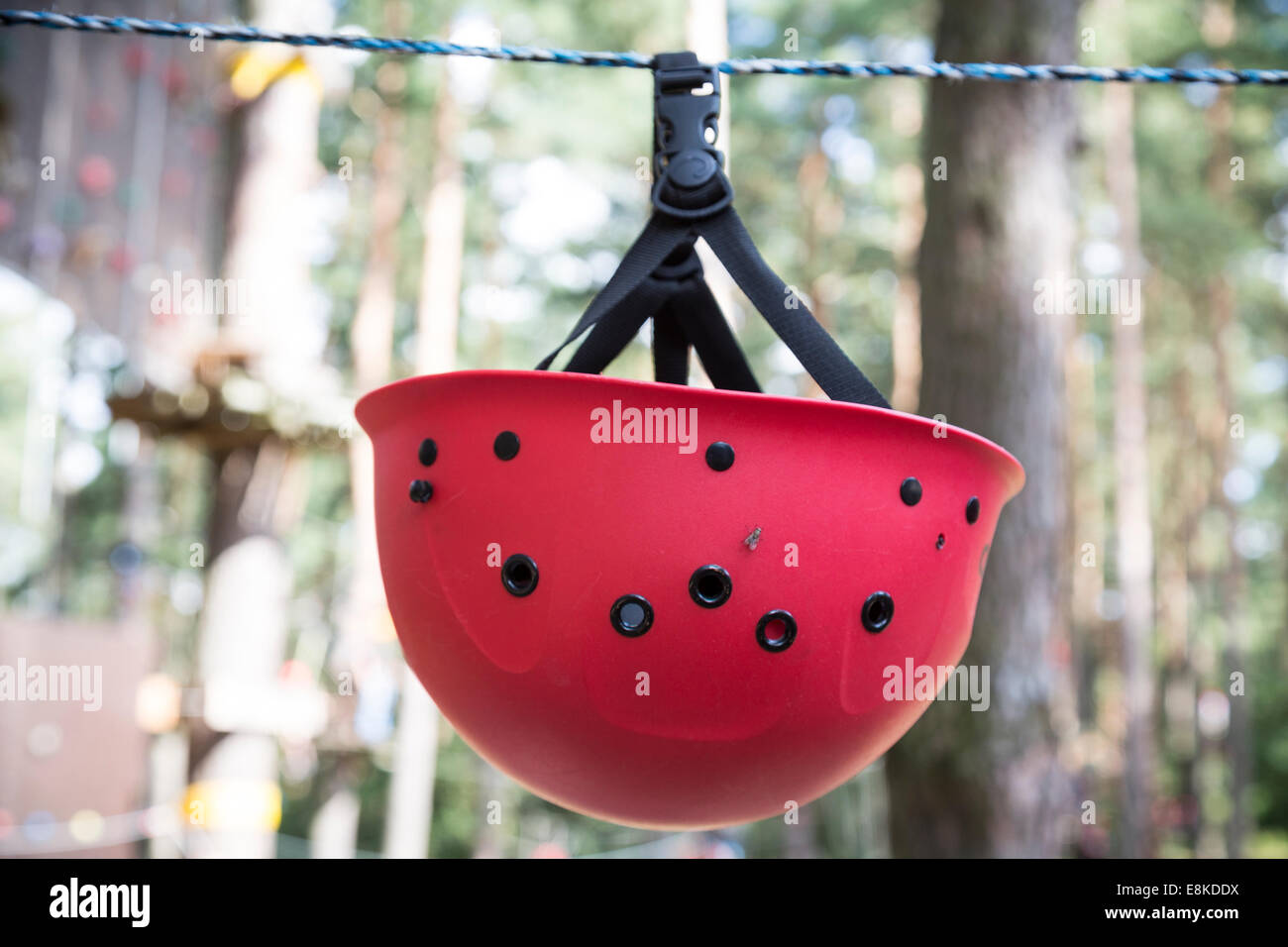 red helmet hanging on a rope Stock Photo - Alamy