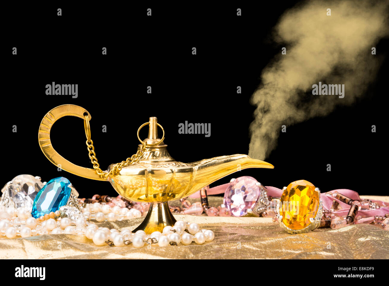The formation of a magical deity from a gold, magic lamp surrounded by ...