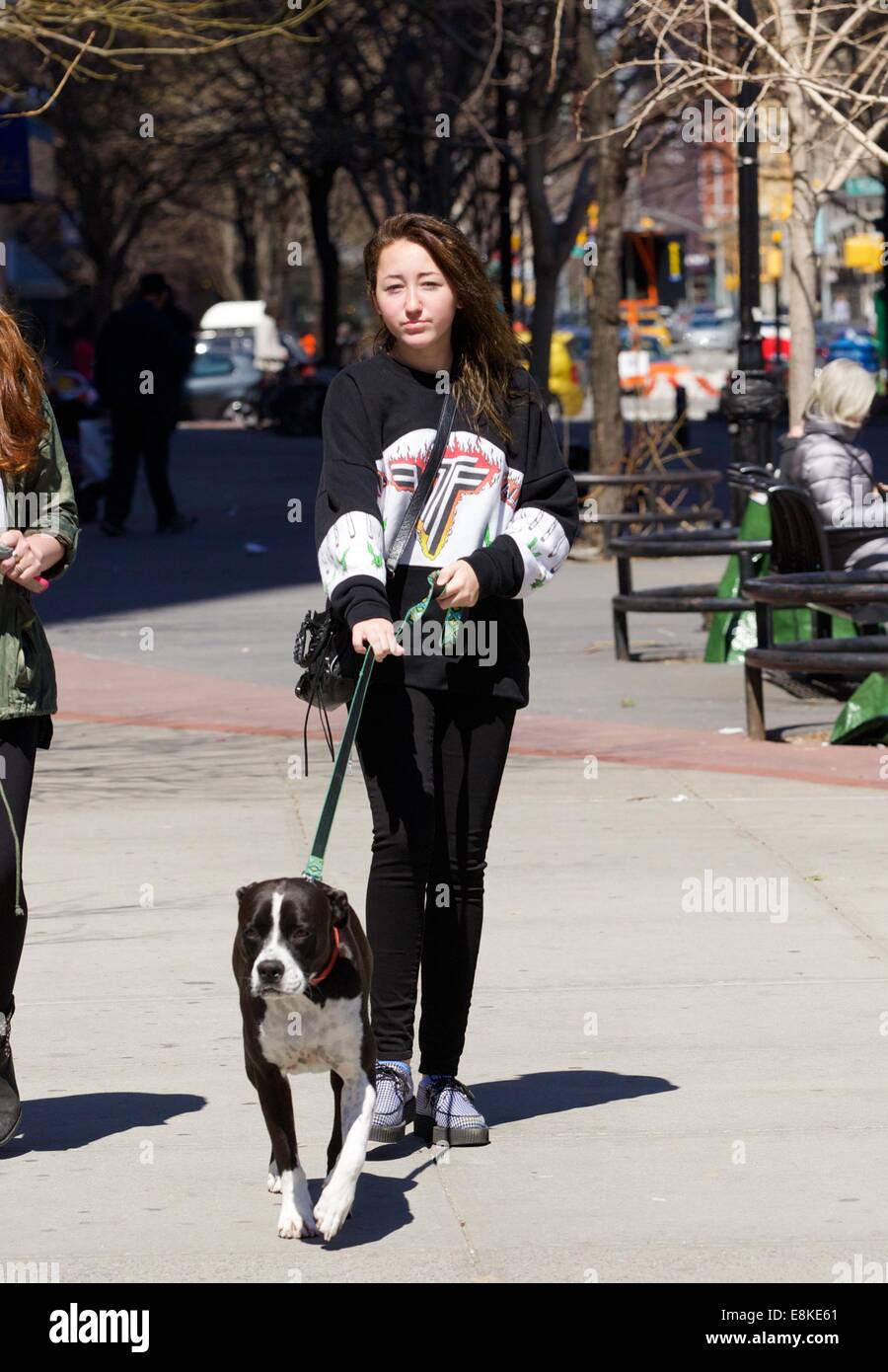 Noah Cyrus seen walking her chocolate and white pet dog called Mary ...