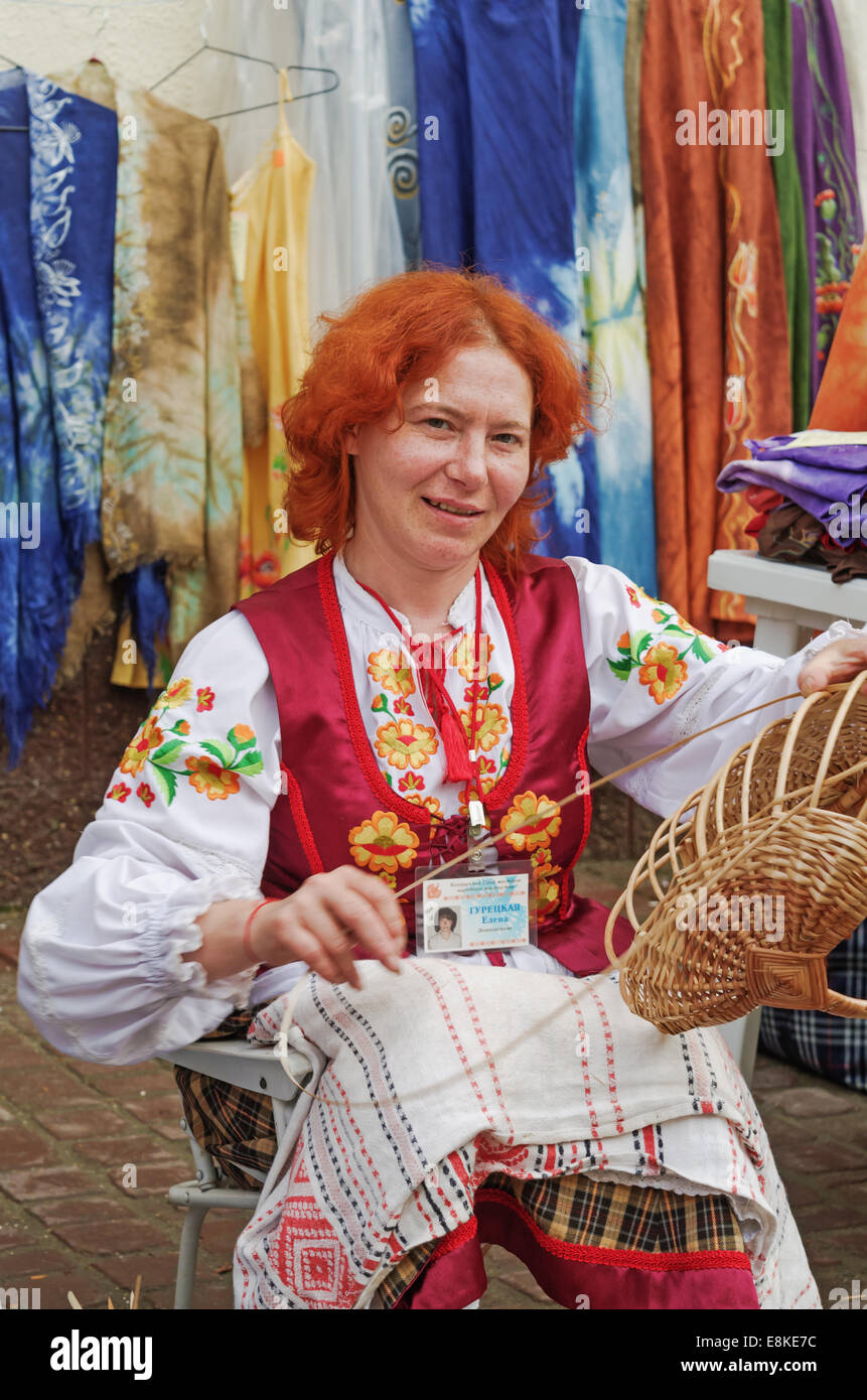 Street of the festival city. The folk master-woman and their works ...