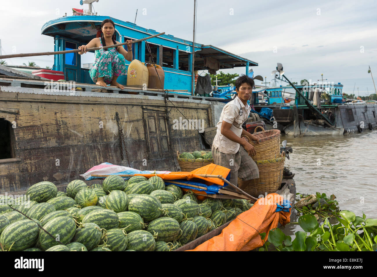 Retailer with water melons meets wholesaler at Cai Rang floating market ...
