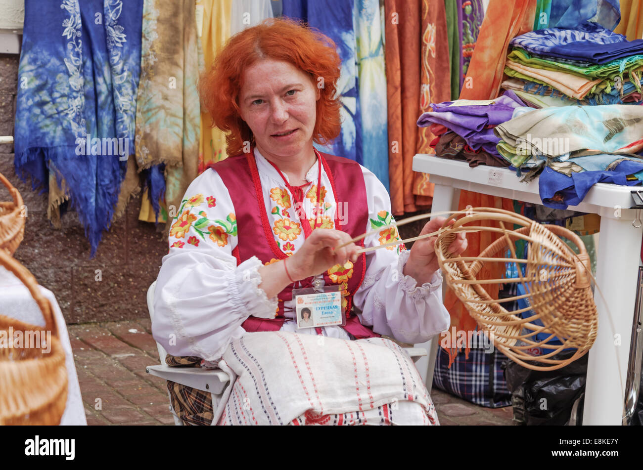Street of the festival city. The folk master-woman and their works ...