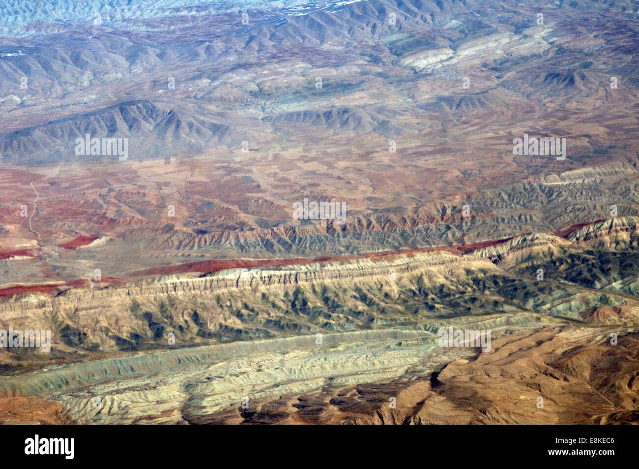 Aerial view of multi coloured rock formations in barren Turkmenistan's ...