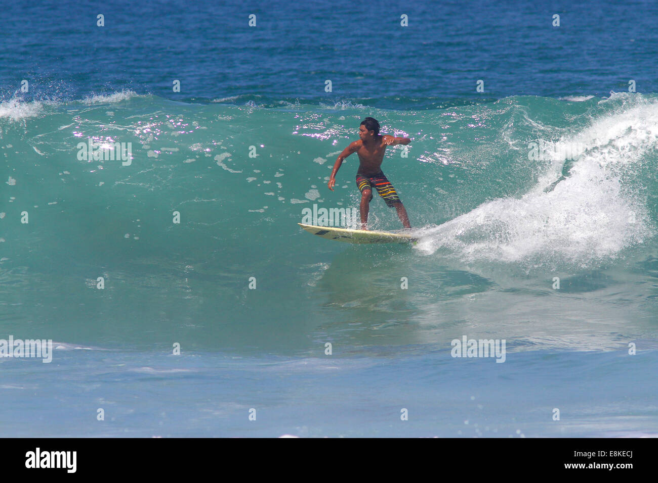 Surfing a wave.Indonesia Stock Photo - Alamy
