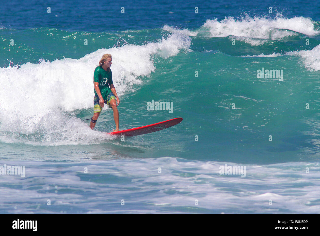Surfing a wave Stock Photo - Alamy