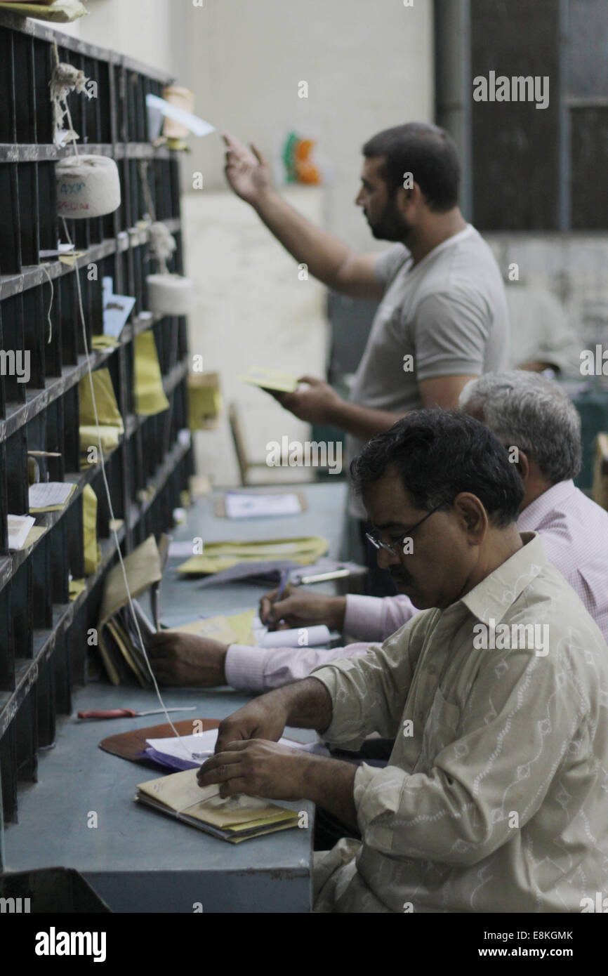 Pakistani Post office workers sorting mails after it was unloaded from ...