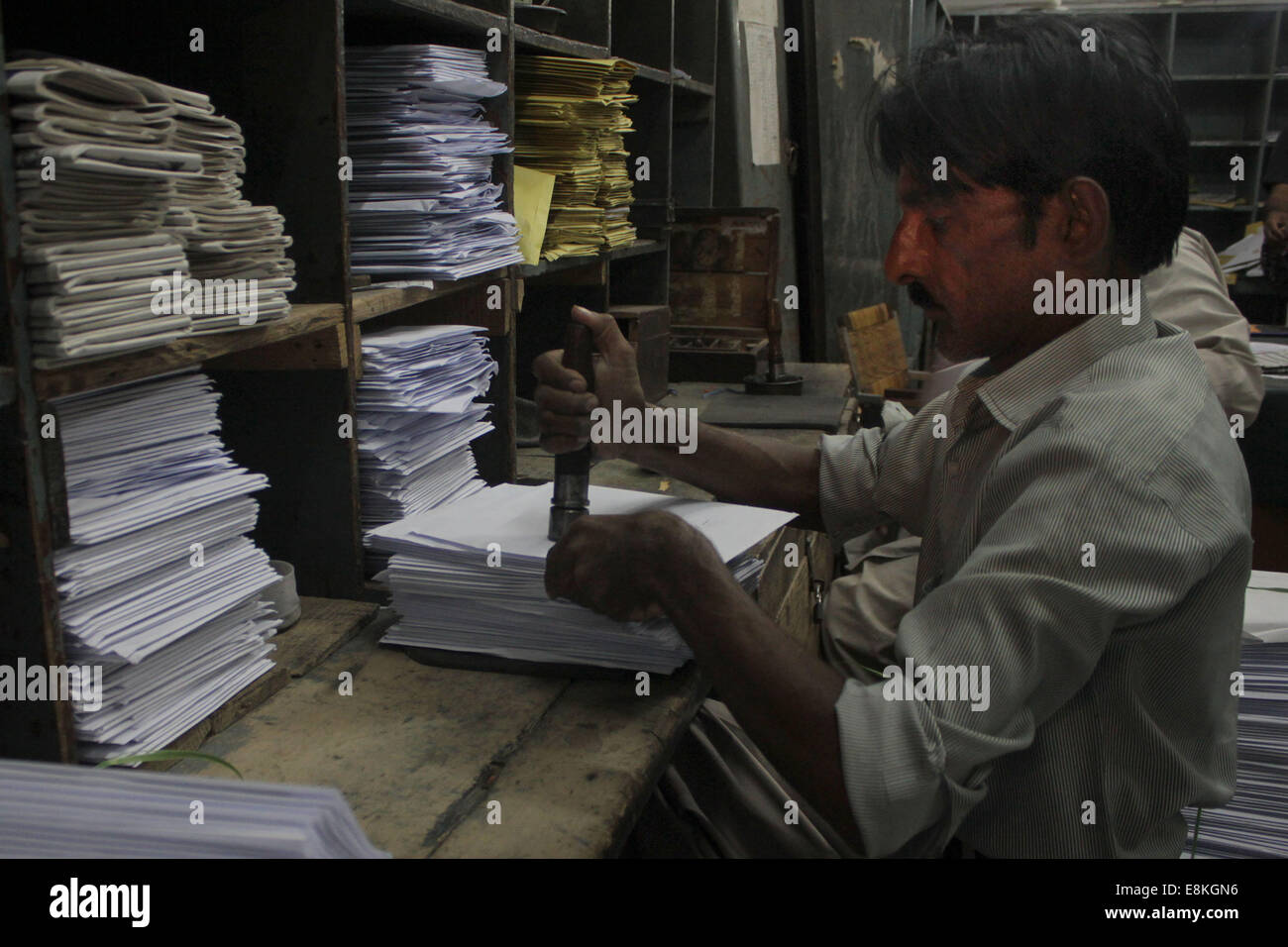 Pakistani Post office workers sorting mails after it was unloaded from ...