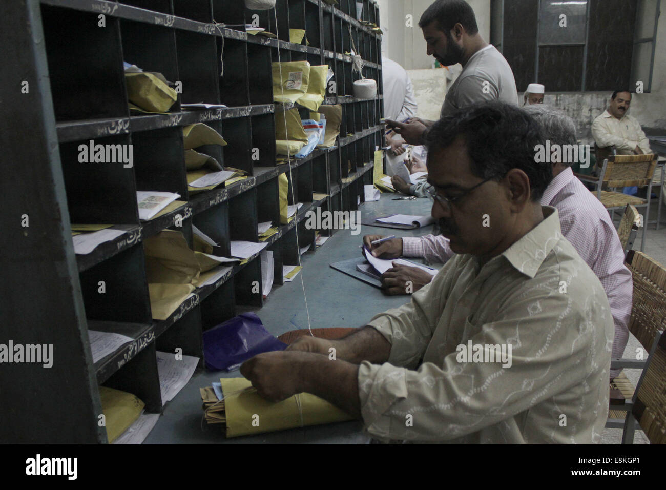 Pakistani Post office workers sorting mails after it was unloaded from ...
