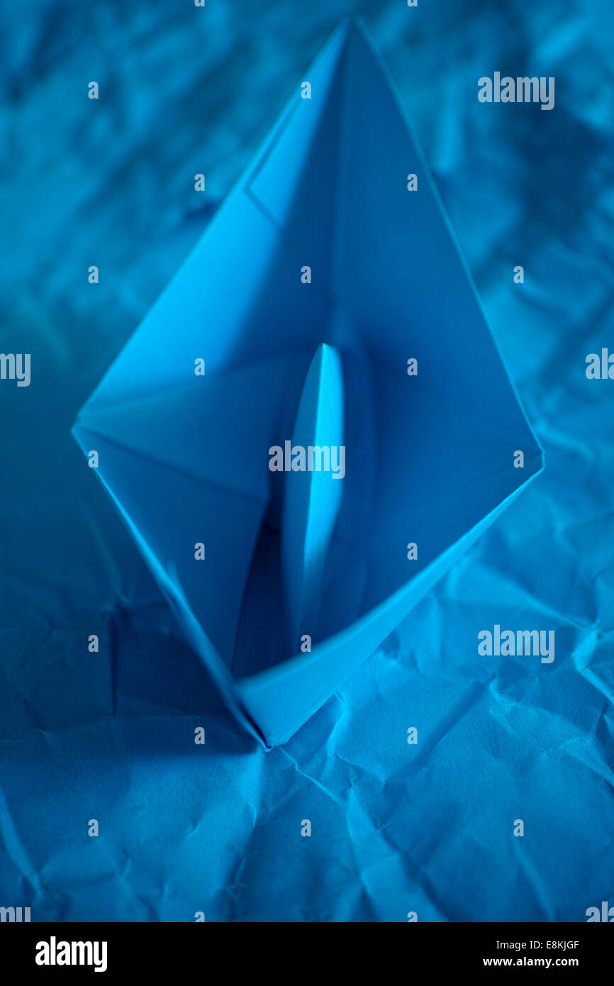 Paper boat in the paper sea Stock Photo - Alamy