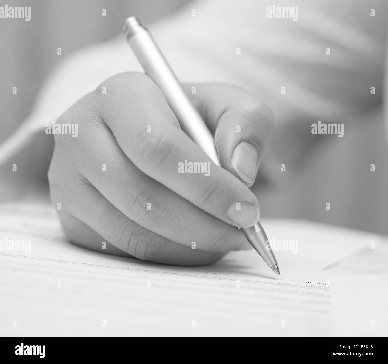Businesswoman signing contract. Black and White image Stock Photo - Alamy