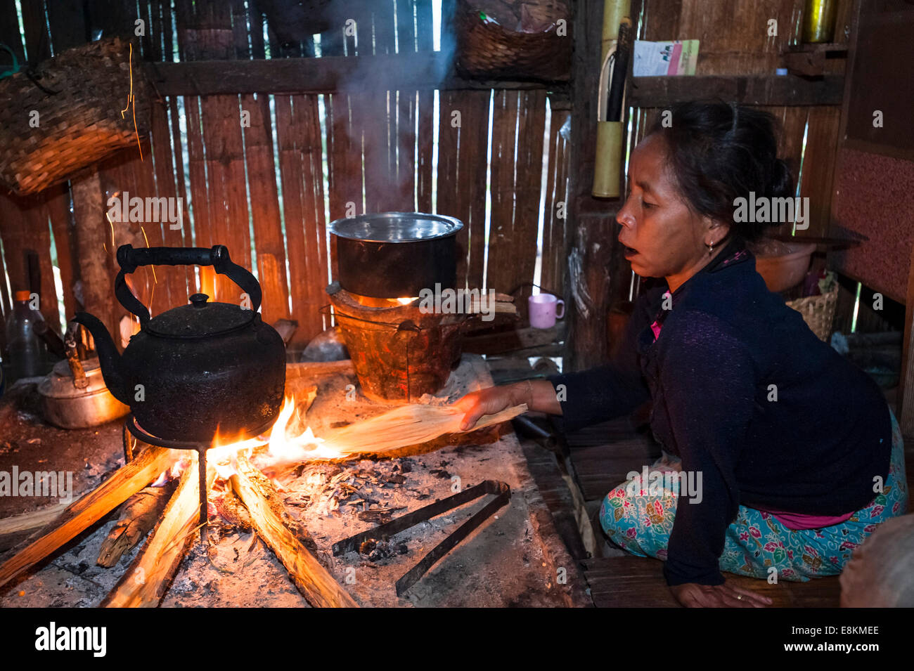 Woman from the Lahu people, hill tribe, ethnic minority, cooking on an ...