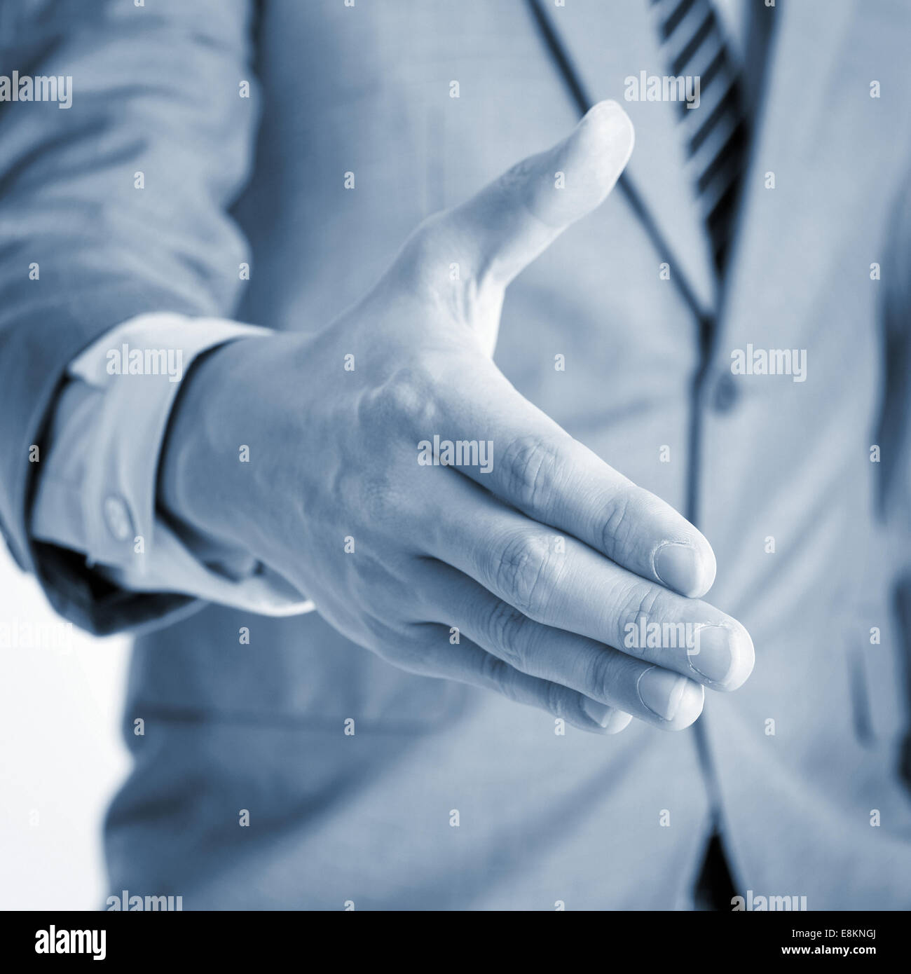 Close up businessman offer hand shake, in blue toned effect Stock Photo ...