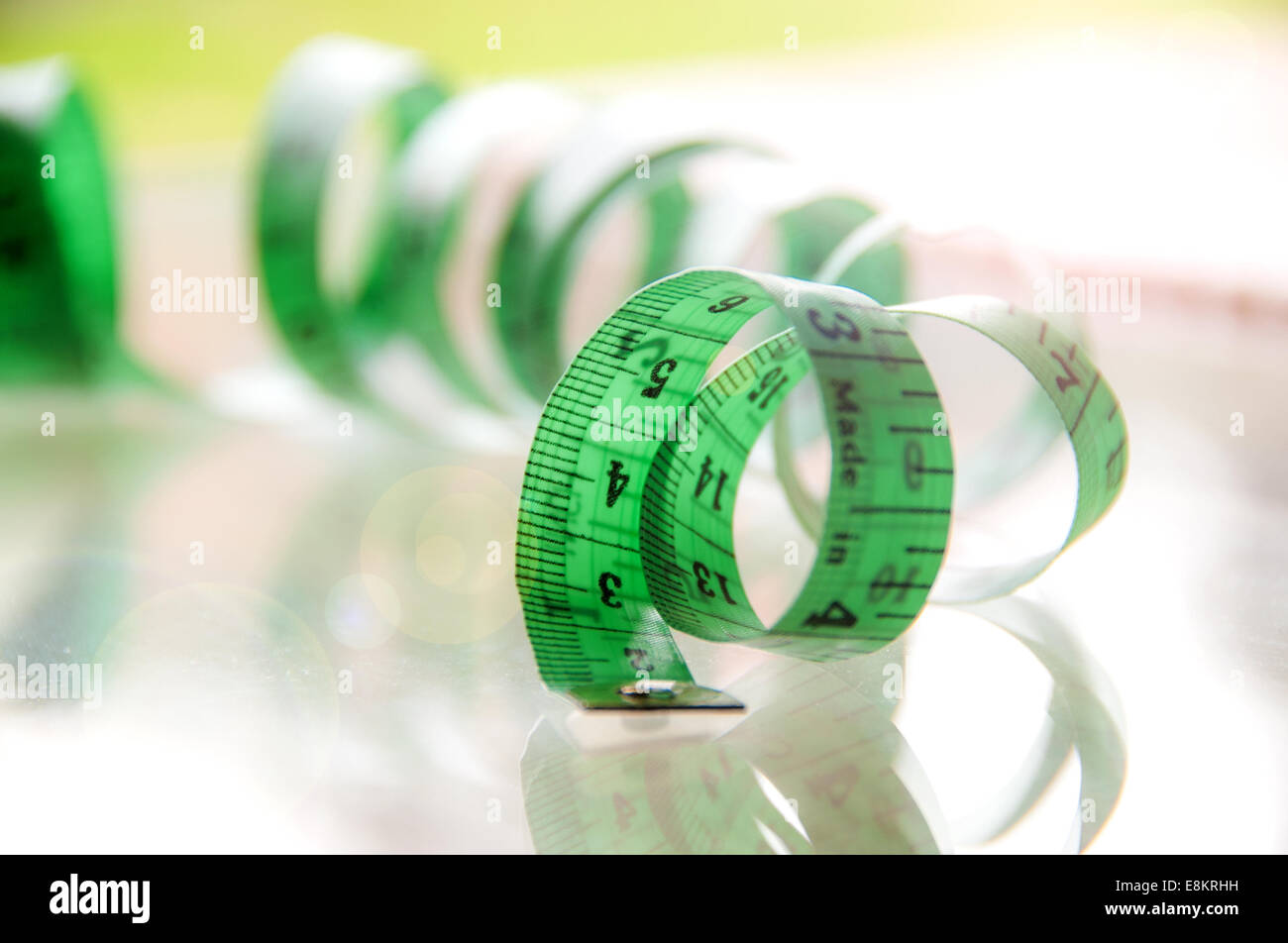 Tape measure spiraling Stock Photo - Alamy