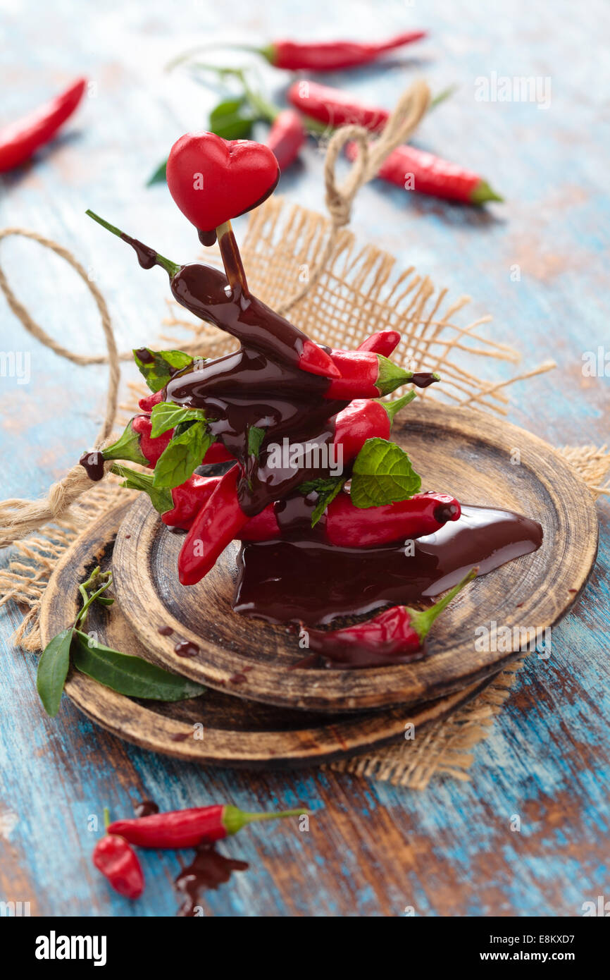 Red chili peppers with mint on sticks Stock Photo - Alamy