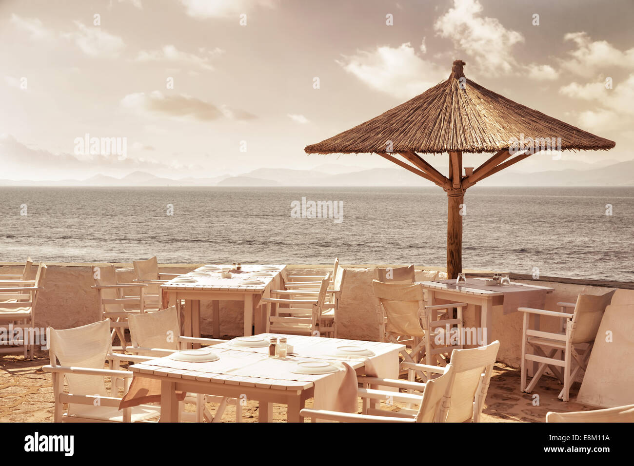 Beach restaurant sunset sea sun tables hi-res stock photography and ...