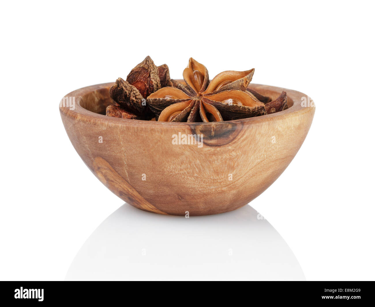 whole anise stars in bowl, isolated on white background Stock Photo - Alamy