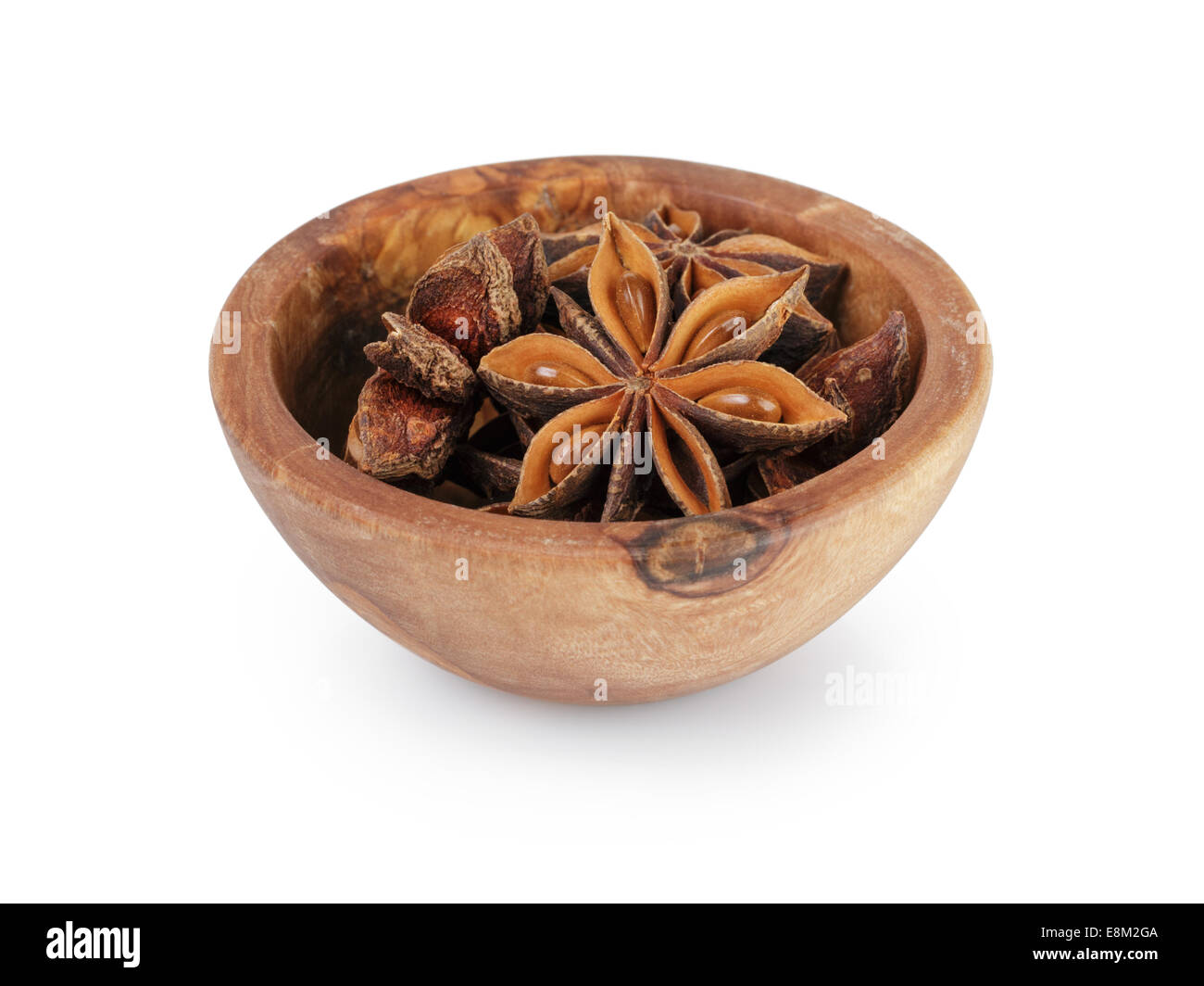 whole anise stars in bowl, isolated on white background Stock Photo - Alamy