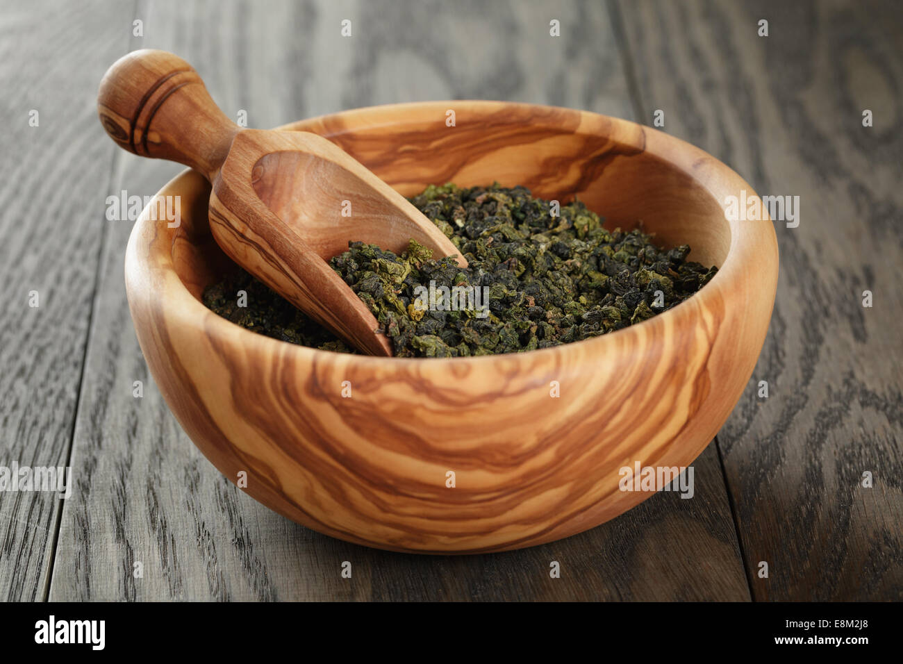 oolong green tea in wood bowl, on oak table Stock Photo - Alamy