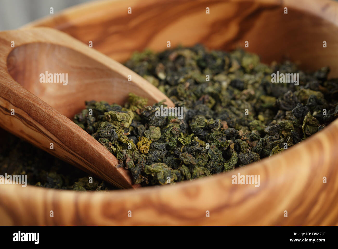 oolong green tea in wood bowl, on oak table Stock Photo - Alamy
