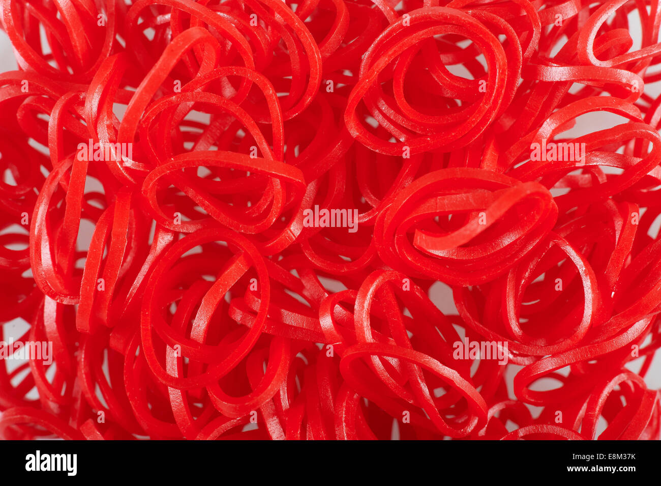 Bright red Loom Bands. Detail. Close up Stock Photo - Alamy