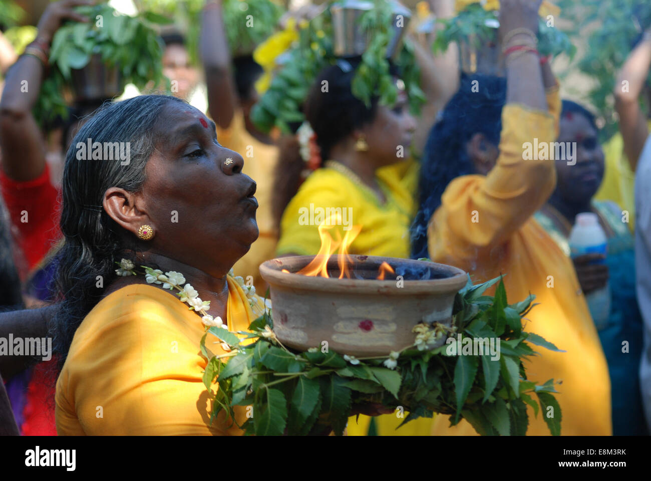 Hindu female devotees carrying fire pot and milk pots in religious ...