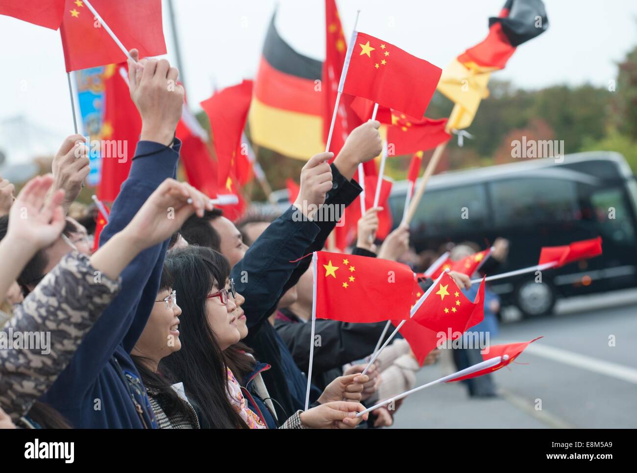 Berlin, Germany. 10th Oct, 2014. People stand outside of the Federal ...