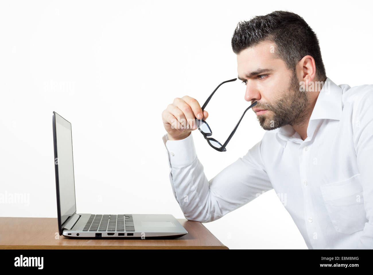 Boss observing laptop Stock Photo - Alamy