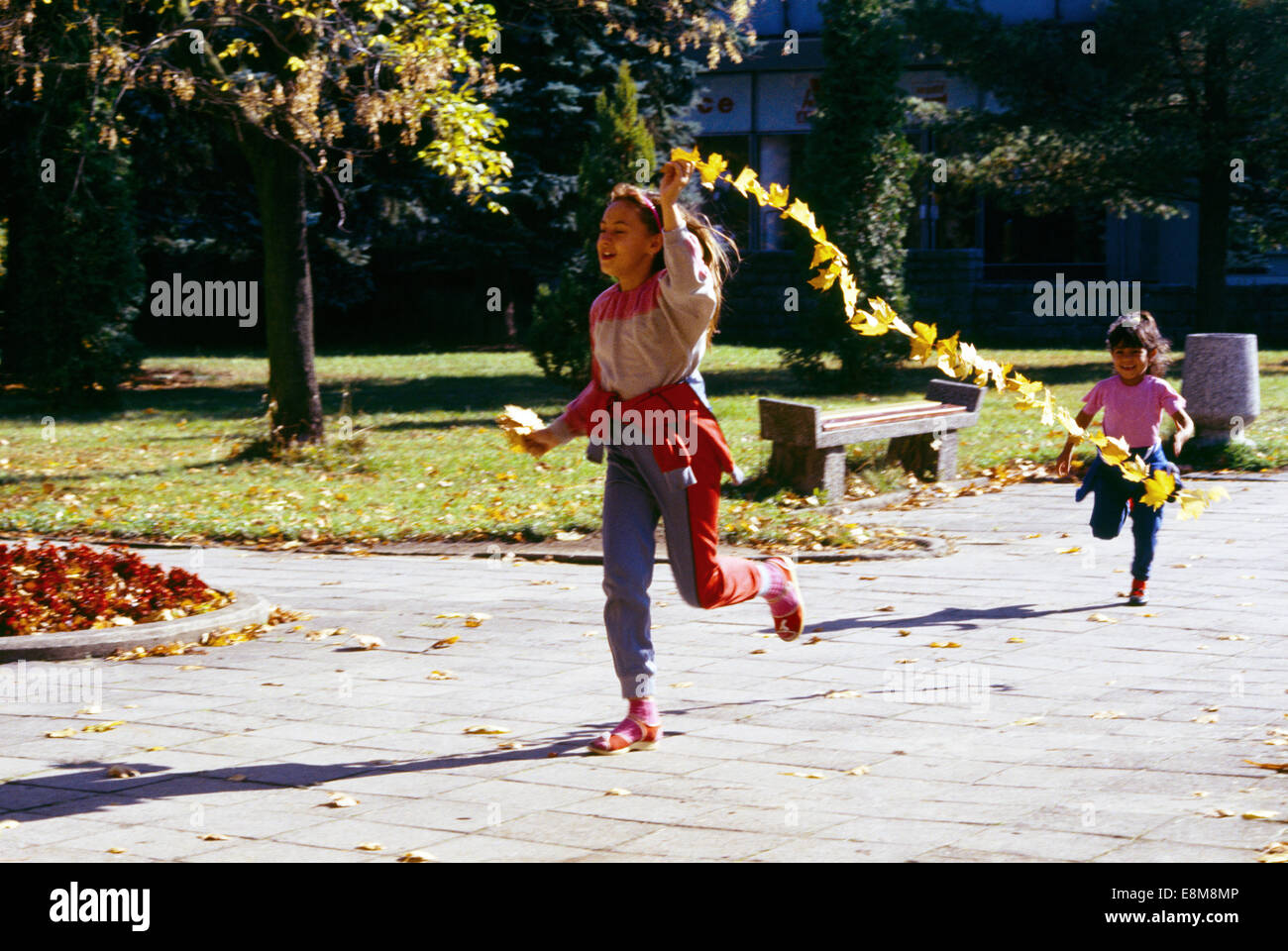 Bohemia Czech Republic Children Playing With Autumn Leaves Stock Photo ...