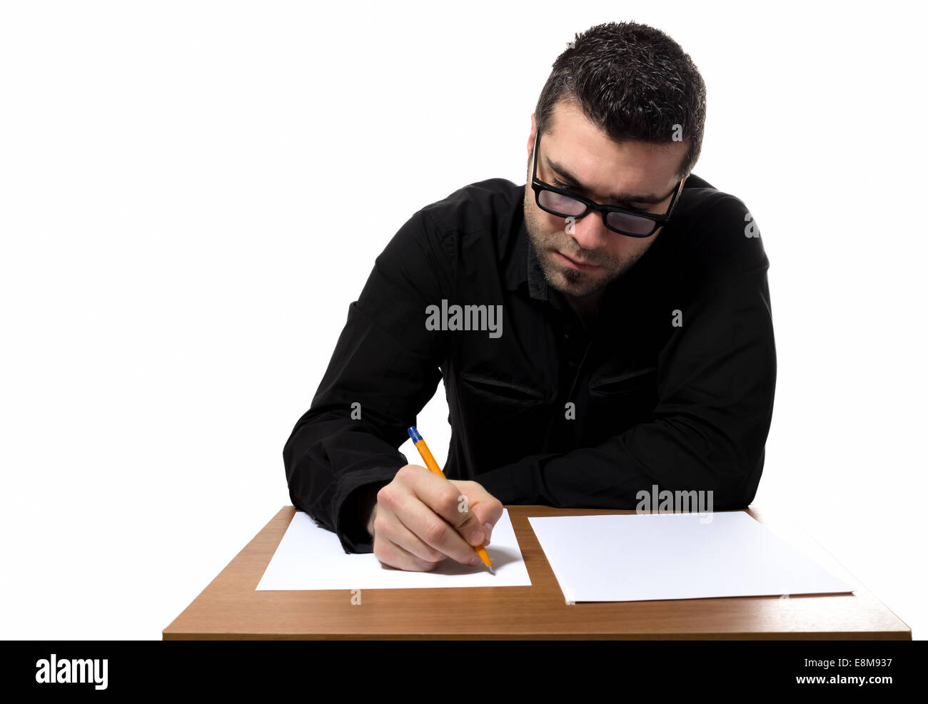 Young man filling forms and papers like taking an exam Stock Photo - Alamy