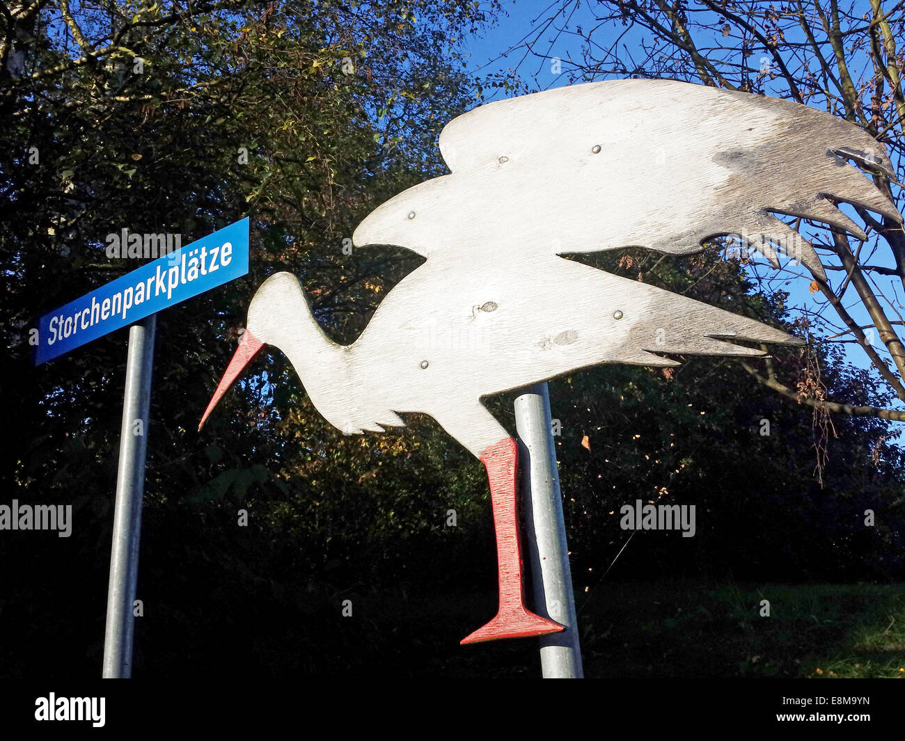 Stork bird as a symbol for new-born babies shows a car park for ...