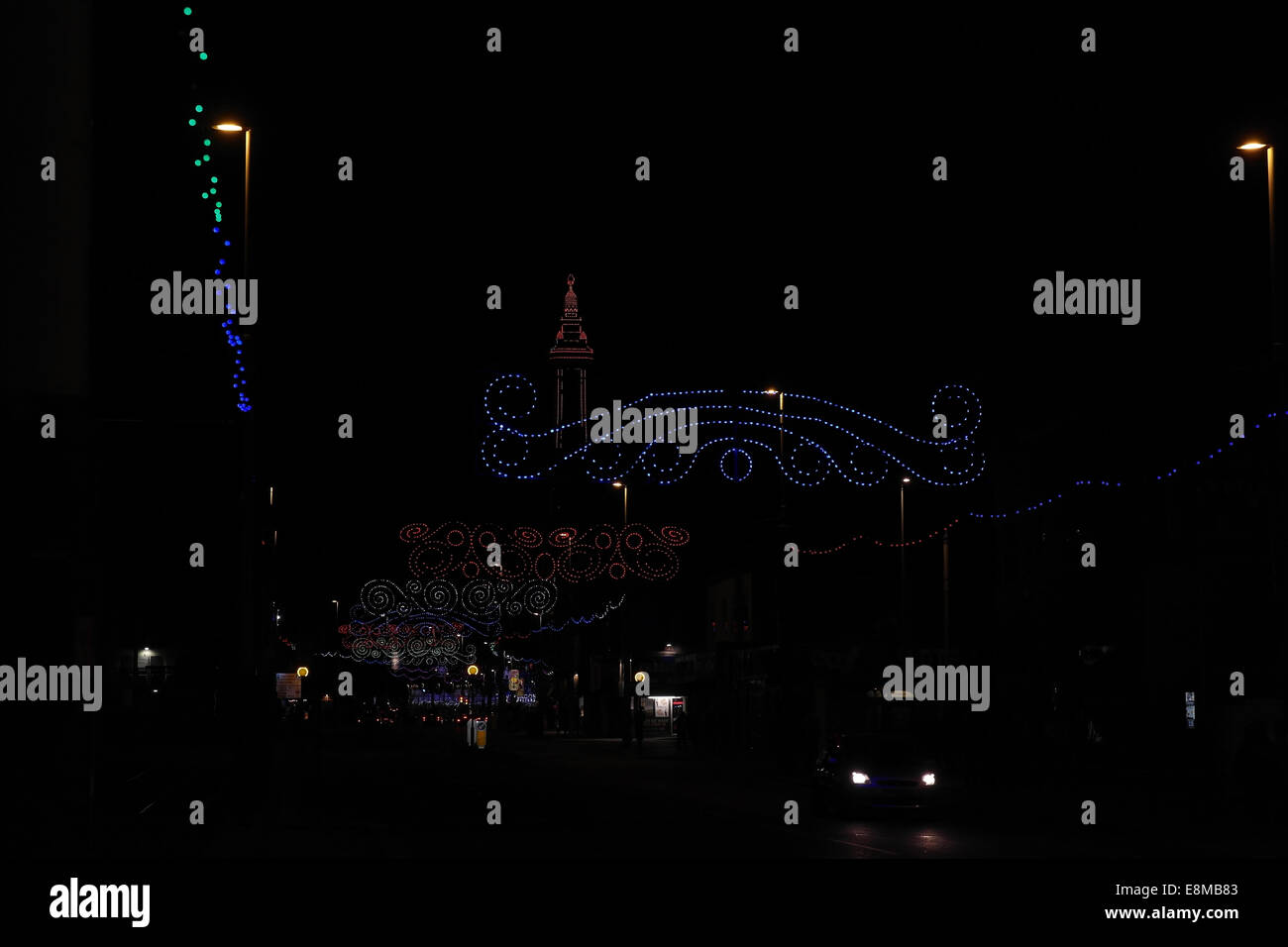 Blackpool tower red green colours illuminated standing rising centre ...