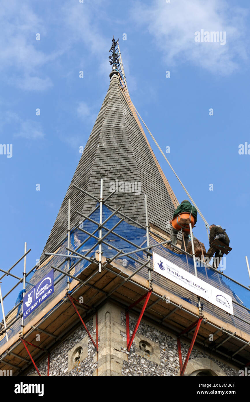 Headley, Surrey, UK. 10th October 2014. Workers repair the historic ...
