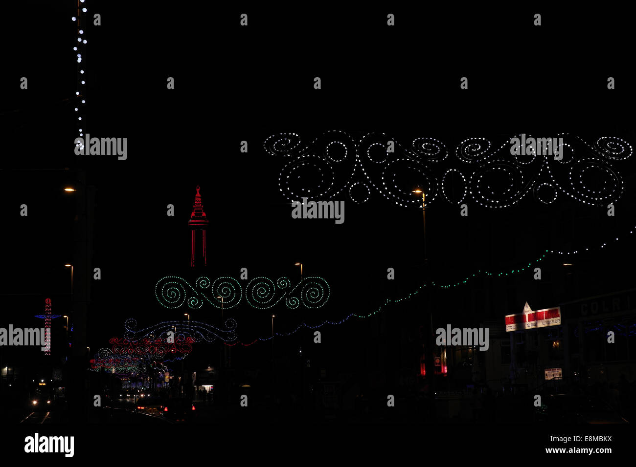 Night view, towards red illuminated Blackpool Tower, mulit-coloured ...