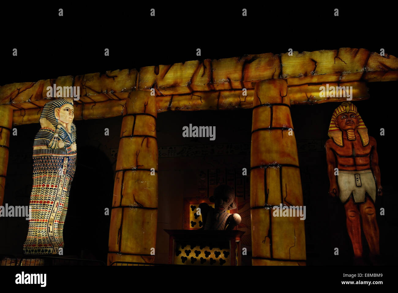 Night view open sarcophagus next to scary pop-up mummy image and ...