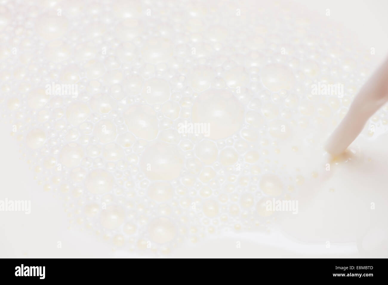 fresh milk pouring into a container for drinking Stock Photo - Alamy