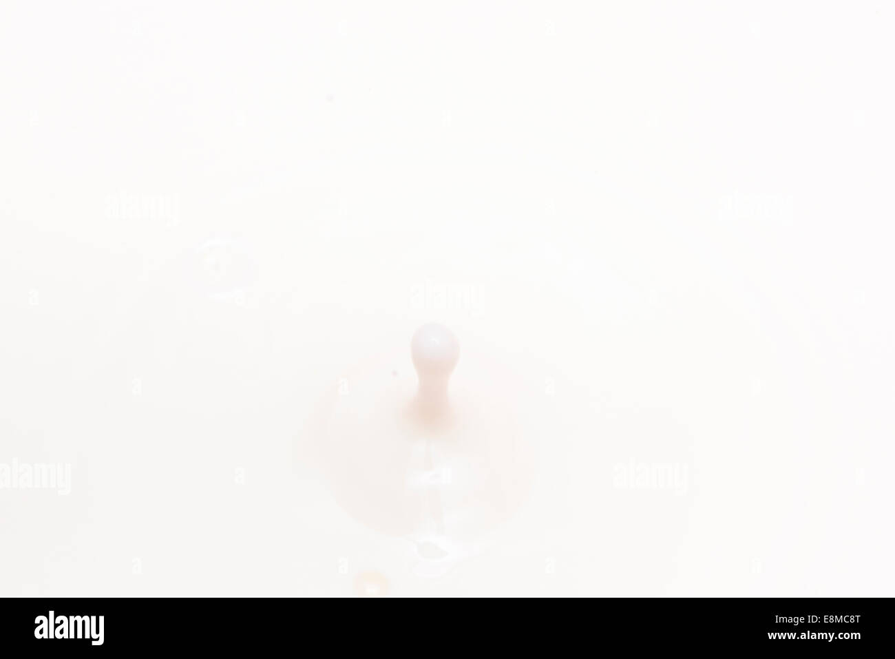 drop of milk falling and splashing Stock Photo - Alamy