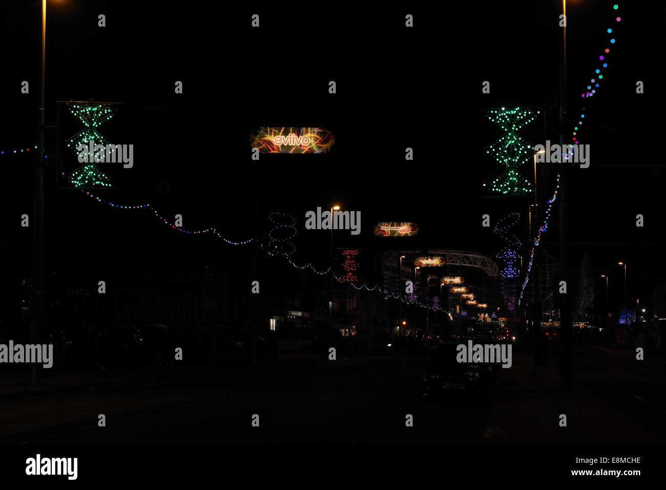 Night view, towards the Pleasure Beach, green, red, purple twisting ...