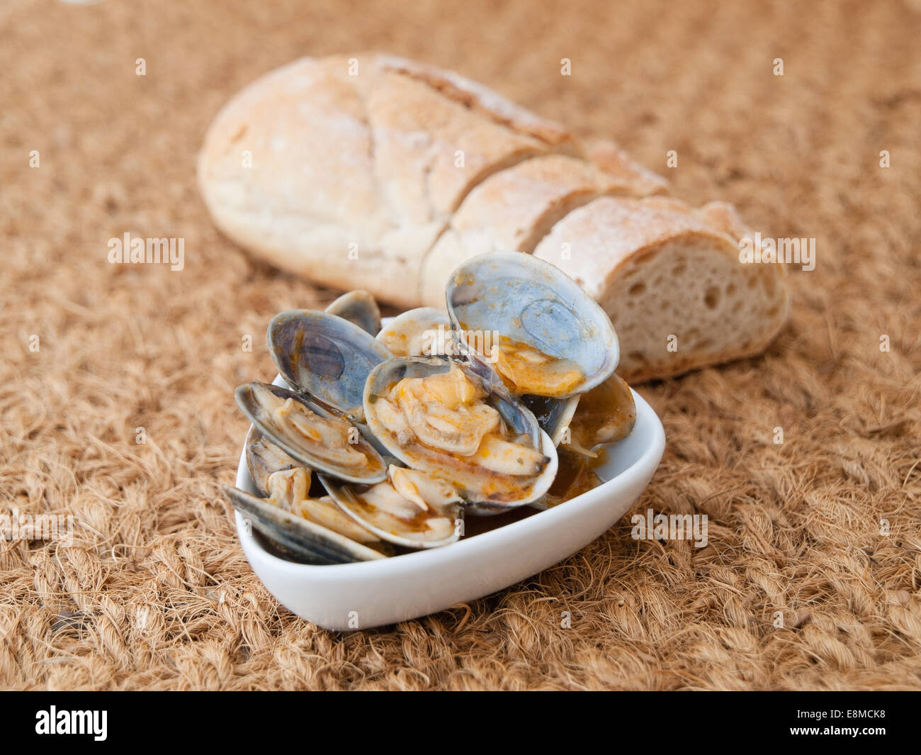 Clams cooked in the recipe "almejas a la marinera" background in a ...