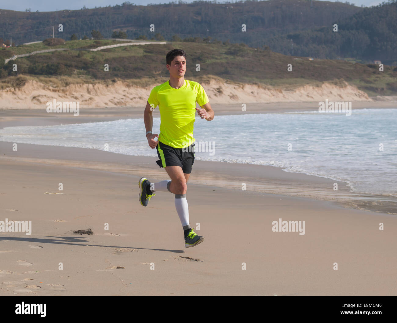 Man running beach hi-res stock photography and images - Alamy