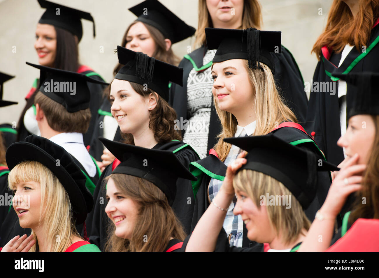 Women Students in their traditional gowns and mortar boards graduating ...