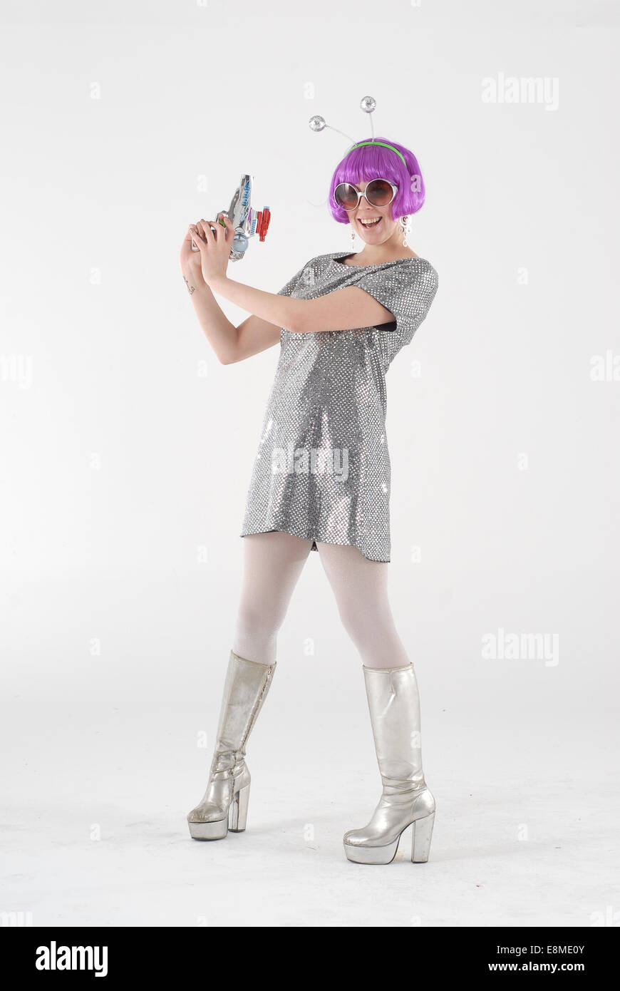 woman in fancy dress comedy costume in 1960s fashion and crazy funny ...