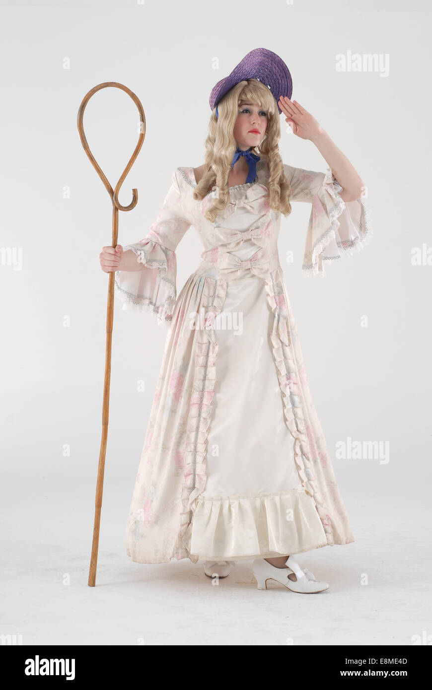 Girl dressed in fancy dress comedy little bow peep outfit shot in a ...